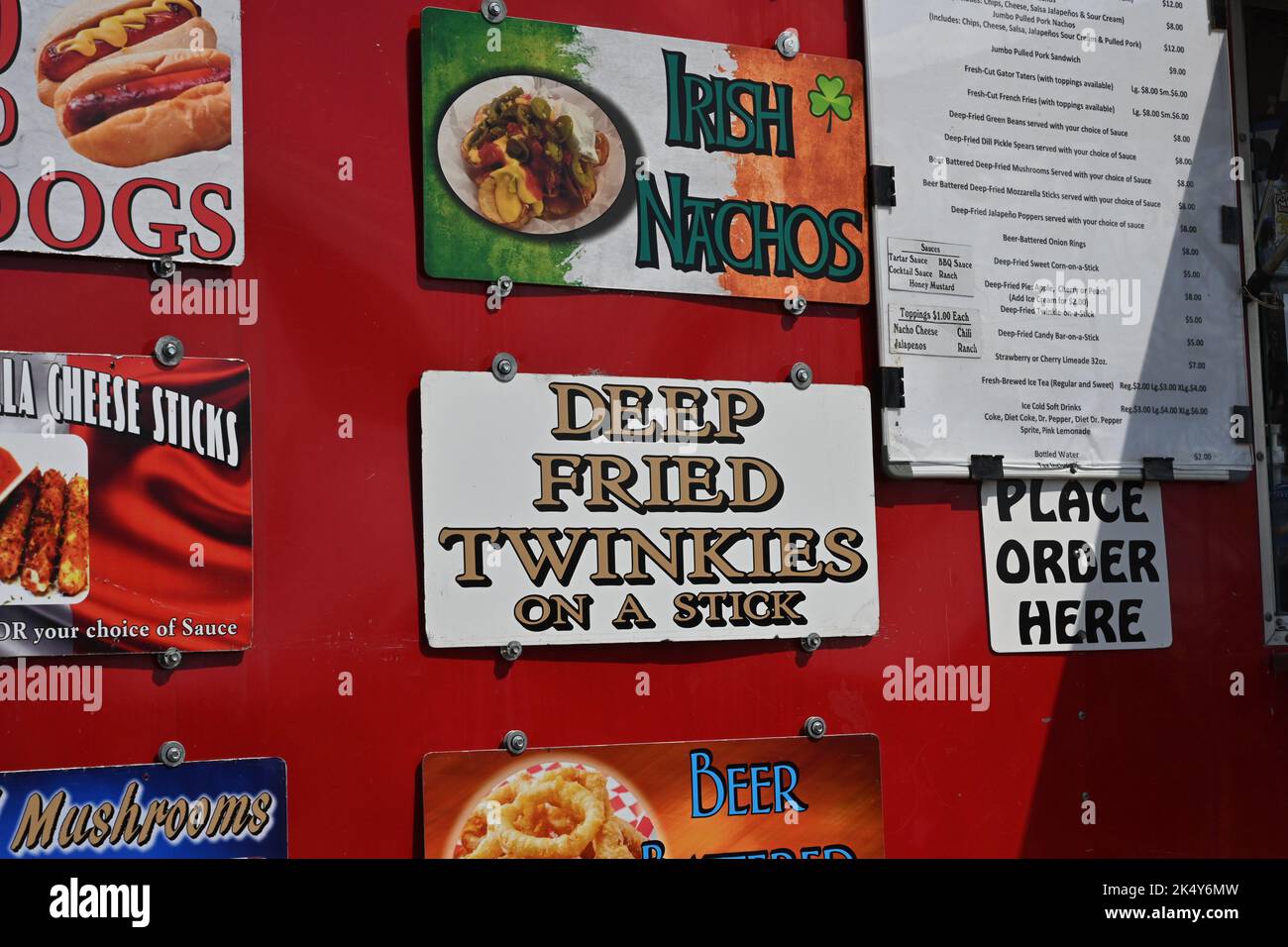 HUTCHINSON, KANSAS - SEPTEMBER 10, 2022 Signs on side of a food booth ...