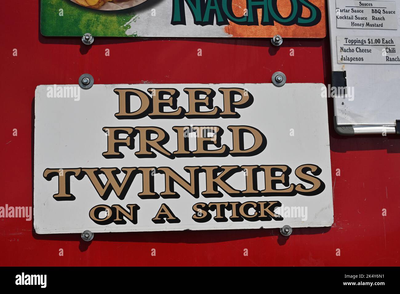 HUTCHINSON, KANSAS - SEPTEMBER 10, 2022 Signs on side of a food booth ...