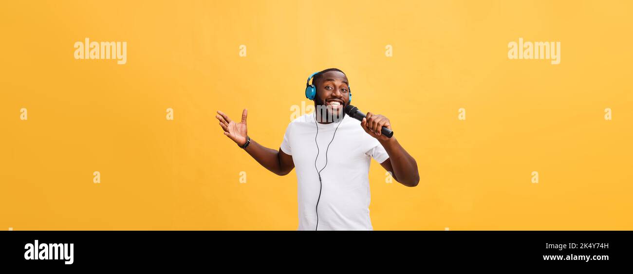 Portrait of cheerful positive chic handsome african man holding ...
