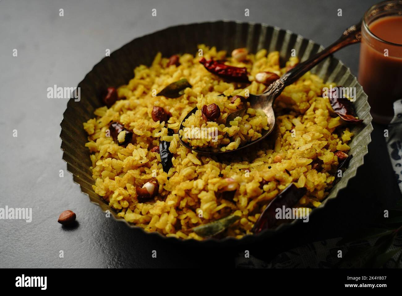 Tamarind Poha or Puli Aval- Indian breakfast with flattened rice Stock ...
