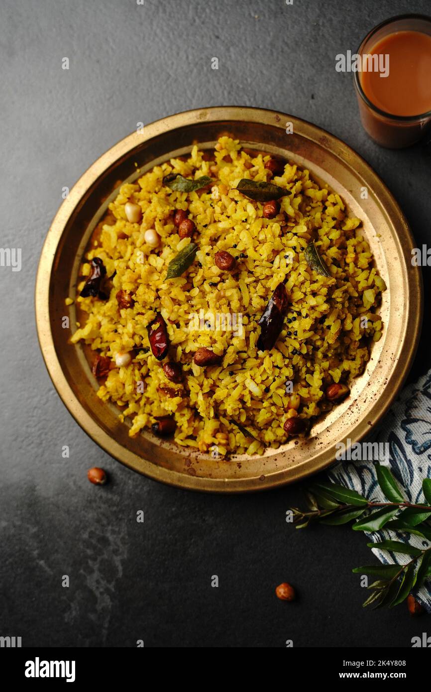 Tamarind Poha or Puli Aval- Indian breakfast with flattened rice Stock ...