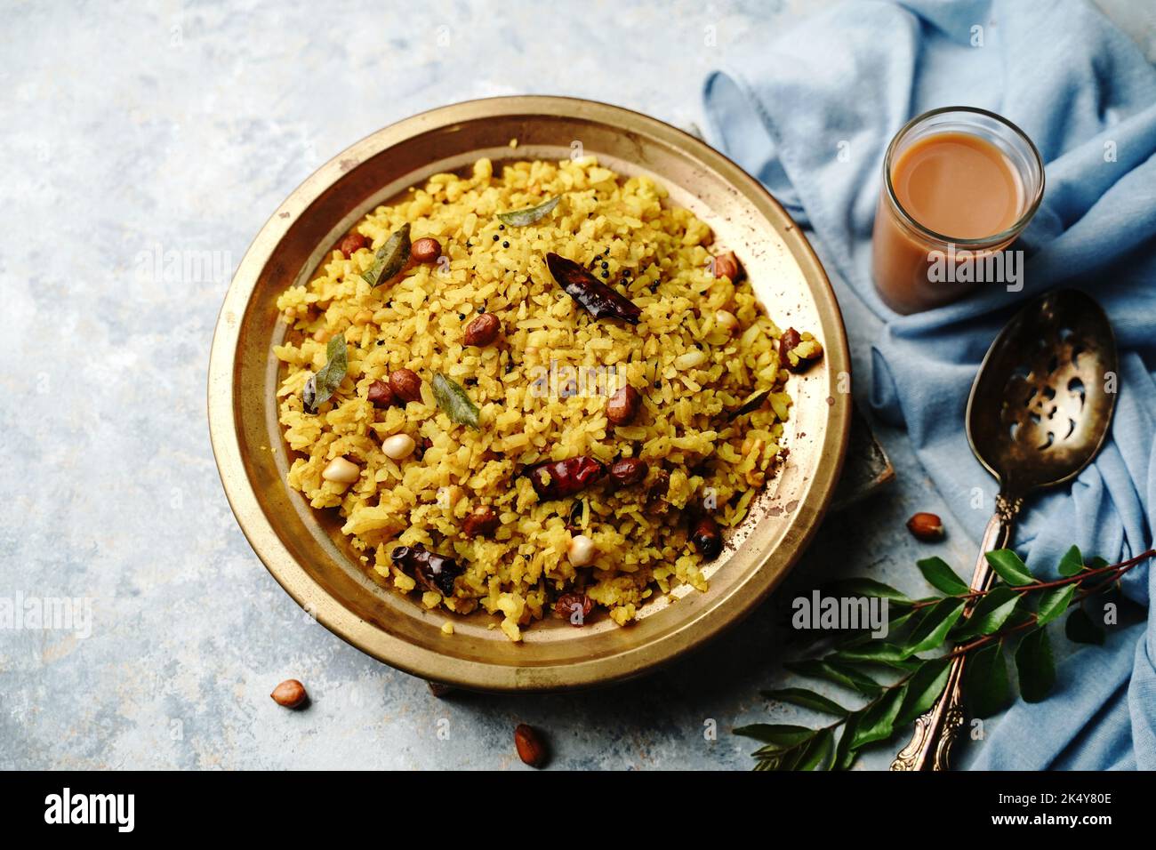 Tamarind Poha or Puli Aval- Indian breakfast with flattened rice Stock ...