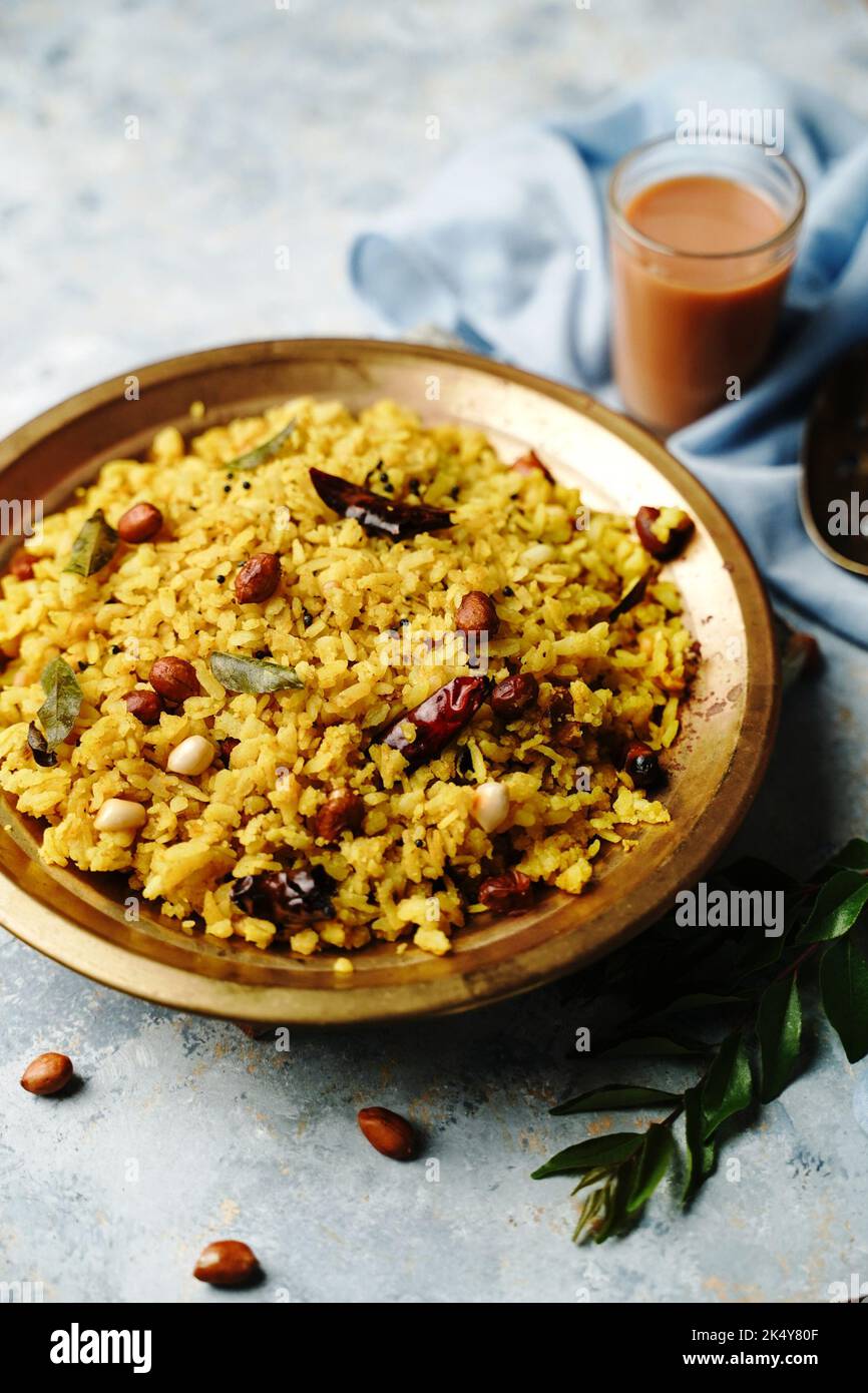Tamarind Poha or Puli Aval- Indian breakfast with flattened rice Stock ...