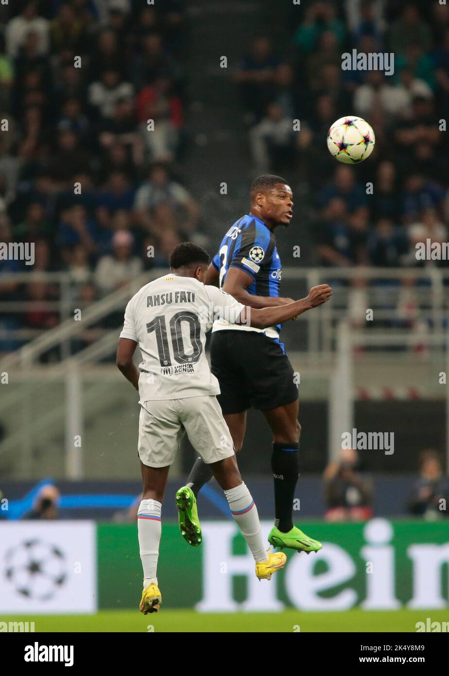 Milan, Italy. 04th Oct, 2022. Denzel Dumfries of Fc Inter and Ansu Fati of Fc Barcelona during ...