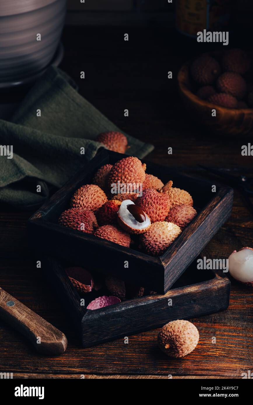 Delicious Fruits of Lychee in Rustic Box Stock Photo - Alamy