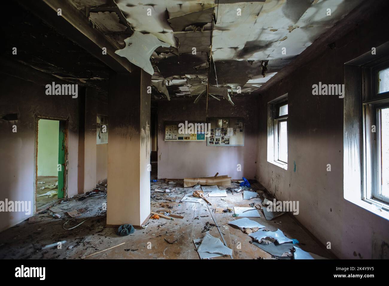 Burnt school interior. Charred walls in black soot. Consequences of ...