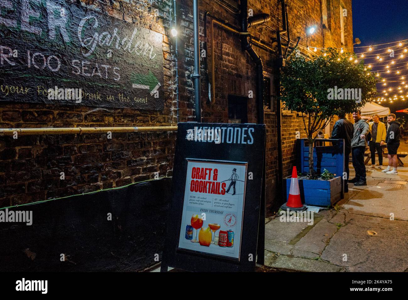 The Keystone public house or pub in the night with A board advertising ...