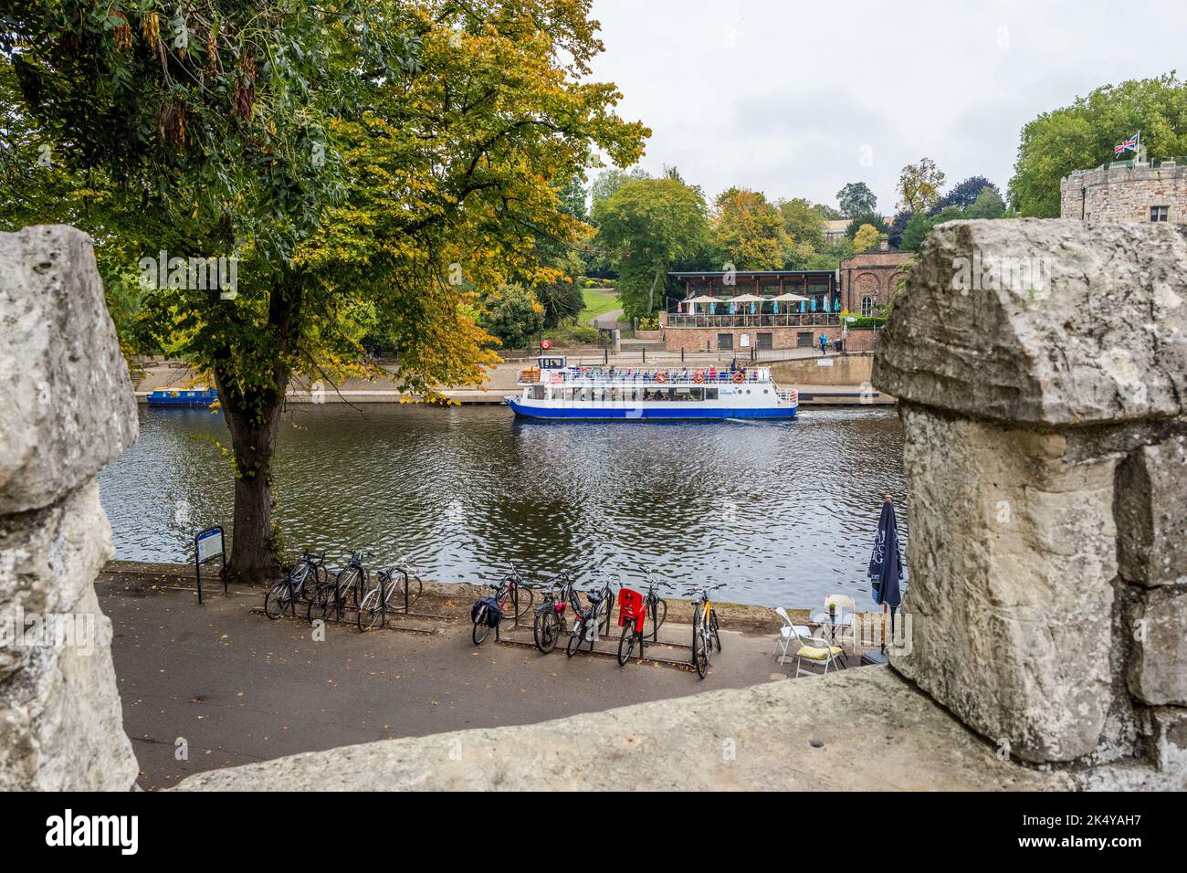 York city river cruises boat with passengers going along the River Ouse ...