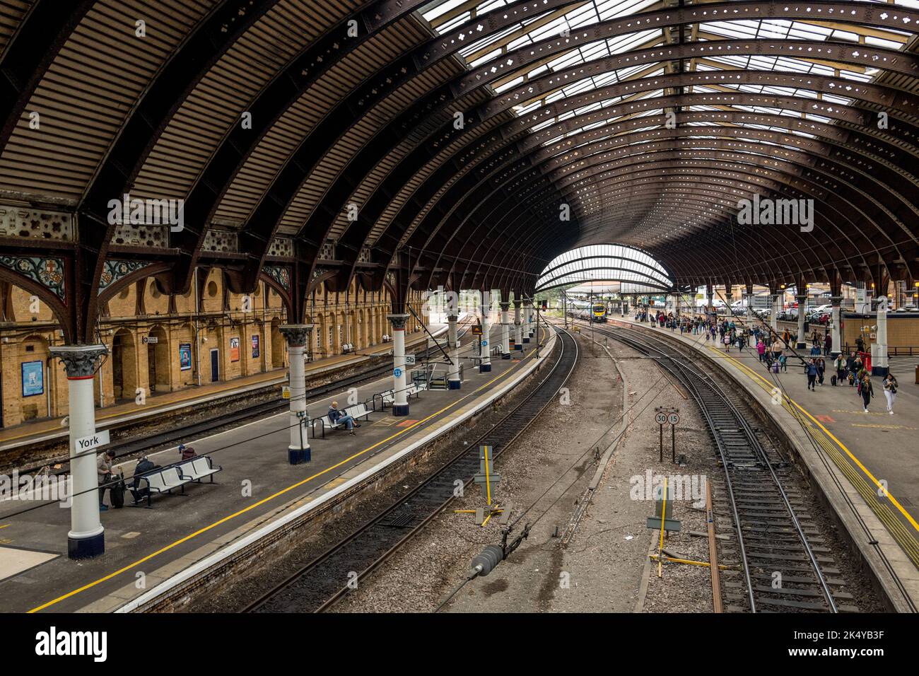 Passengers waiting on York railway station platform Stock Photo - Alamy