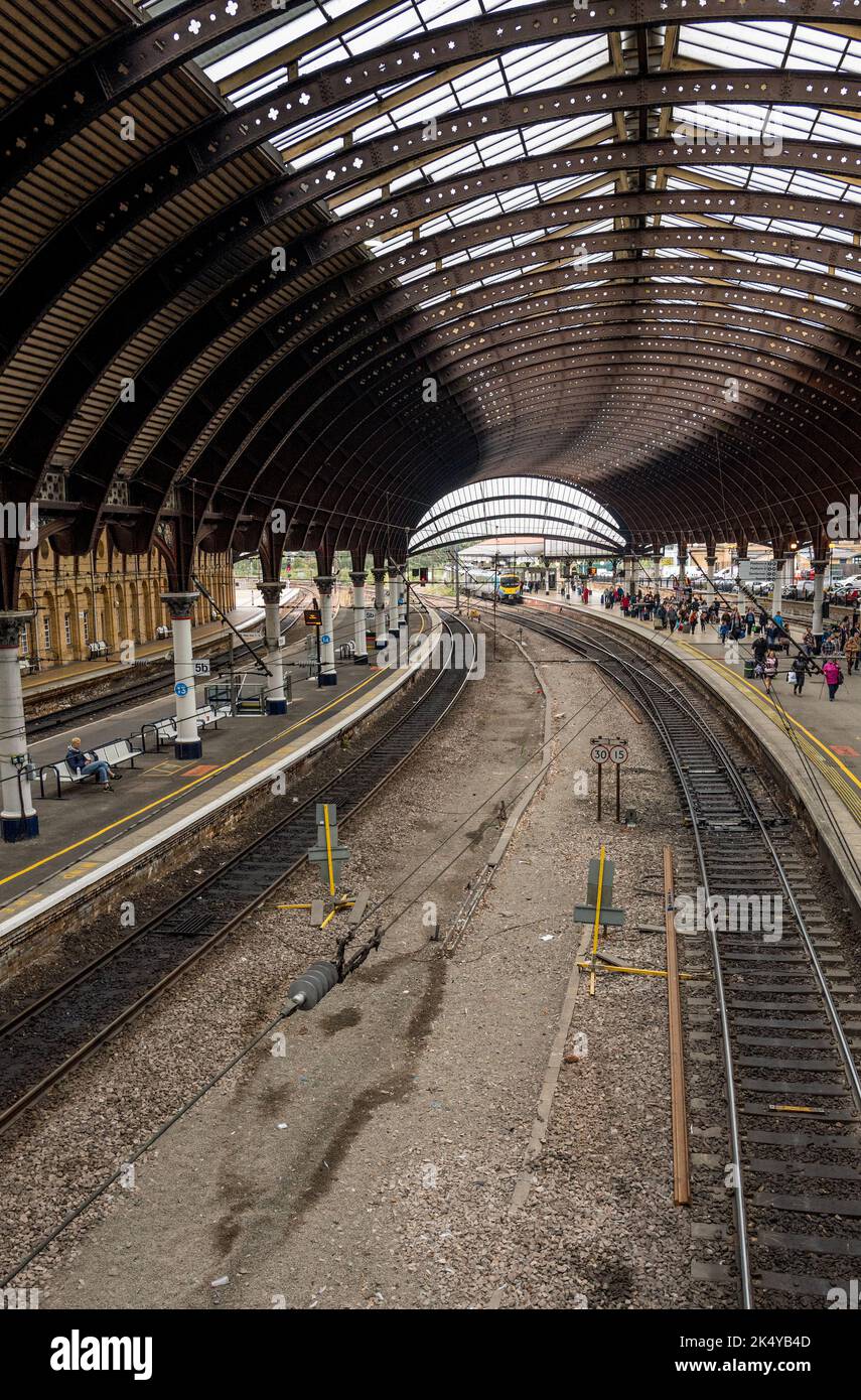 Passengers waiting on York railway station platform Stock Photo - Alamy