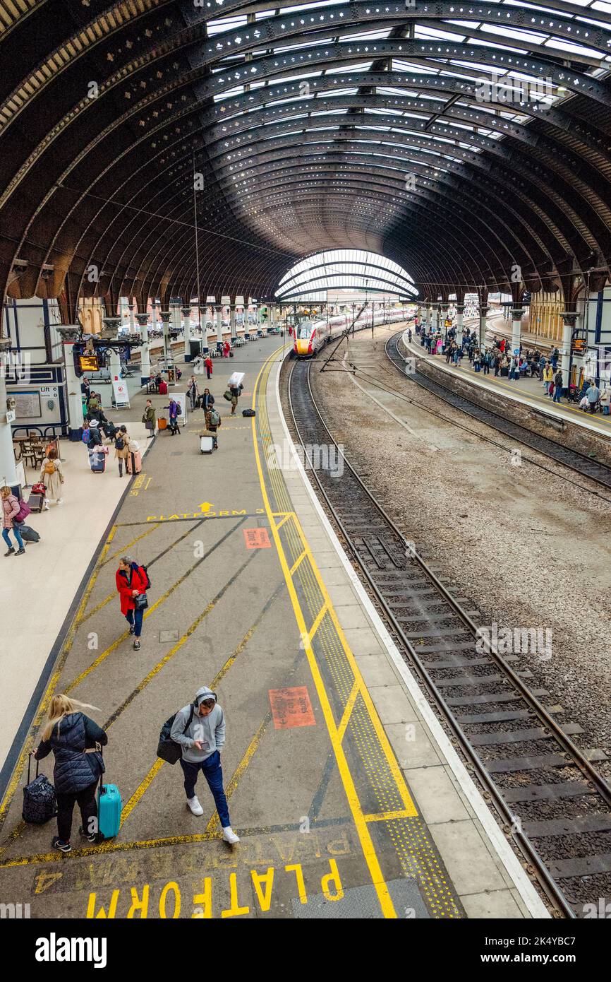 Passengers waiting on York railway station platform for the Azuma ...