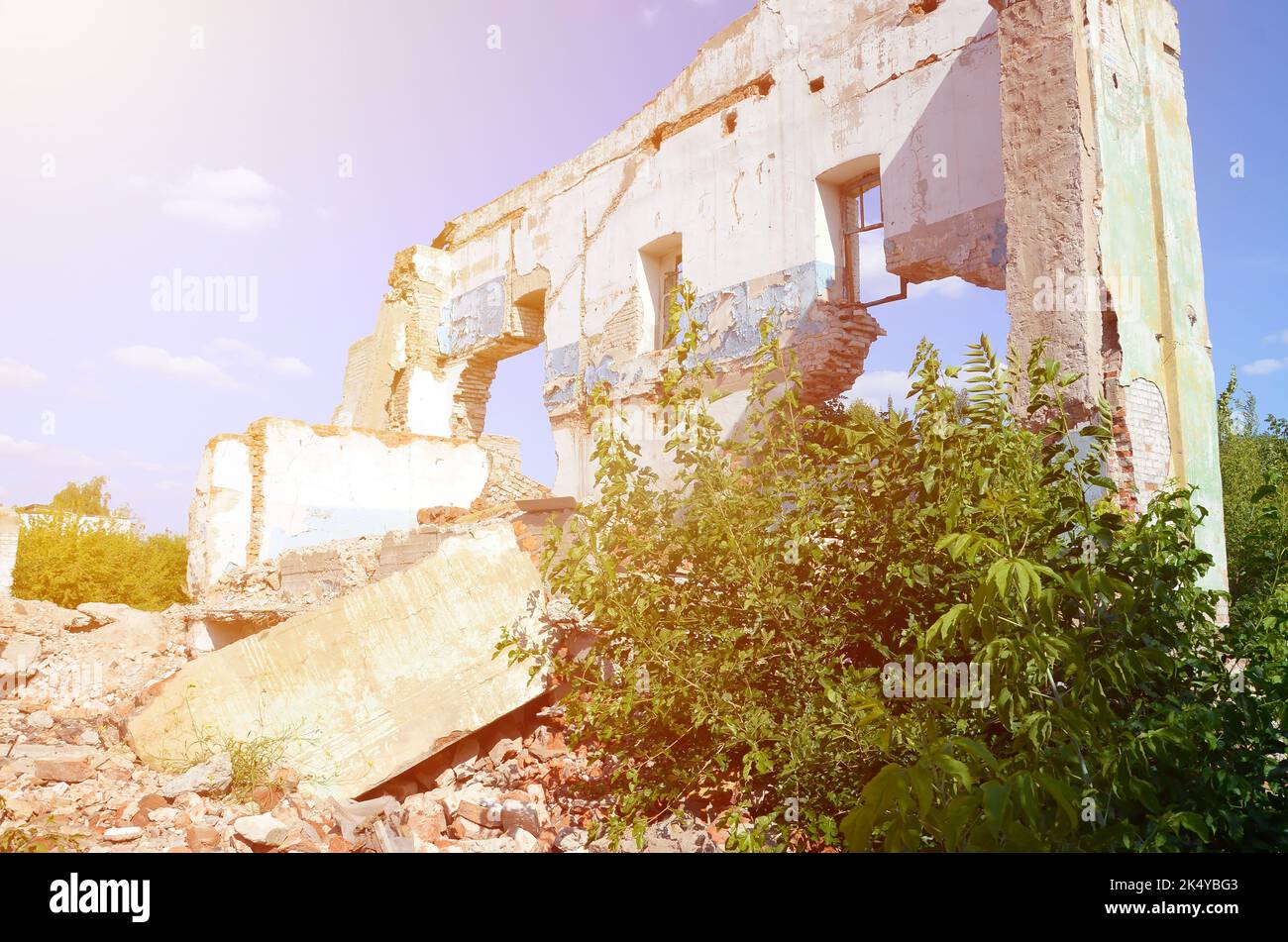 Collapsed industrial multistorey building in daytime. Disaster scene ...