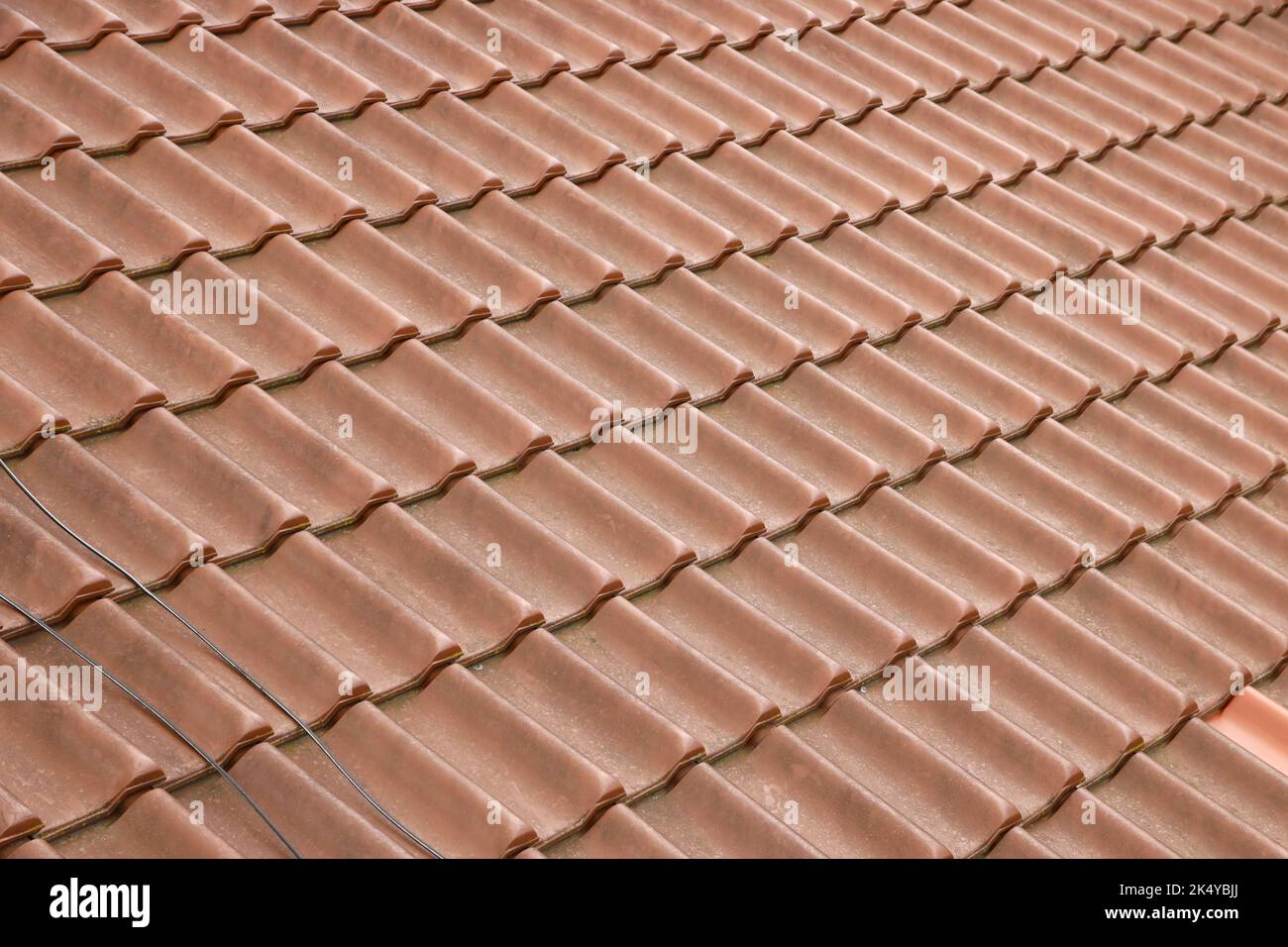 Architectural textured background of brown roof metal tile. Roof of a ...