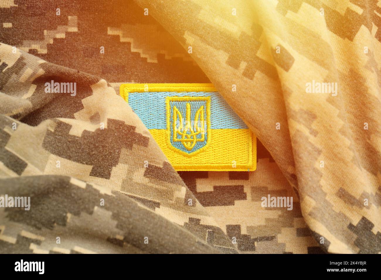 Pixeled digital military camouflage fabric with ukrainian flag and coat ...
