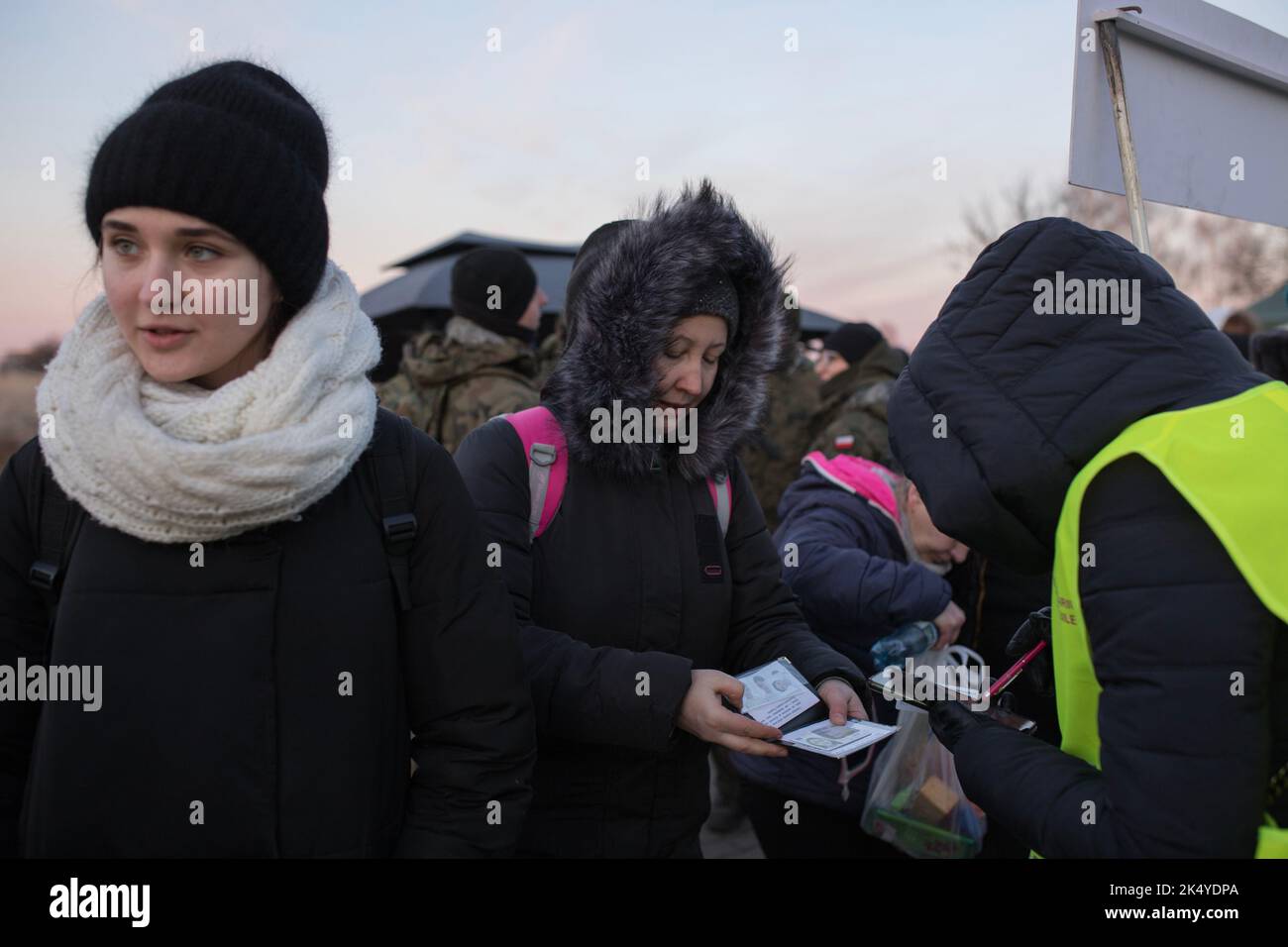 Medyka, Poland. 11th Mar, 2022. A displaced Ukrainian woman shows her ...