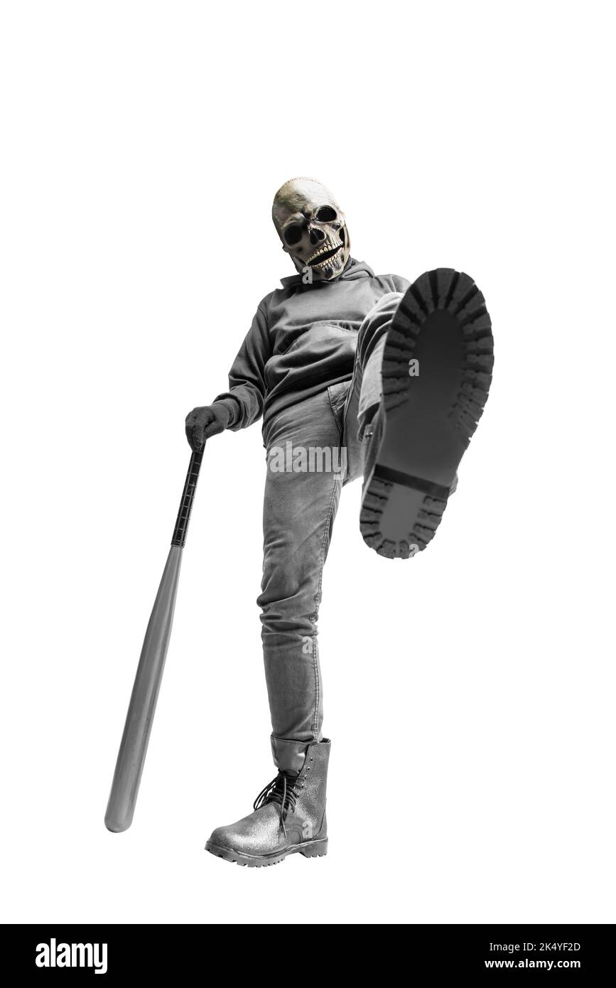 Man with a skull head costume for Halloween holding baseball bat ...