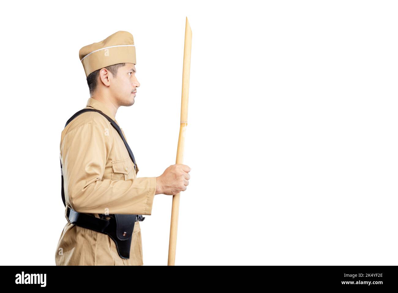 Indonesian freedom fighter standing while holding sharpened bamboo ...