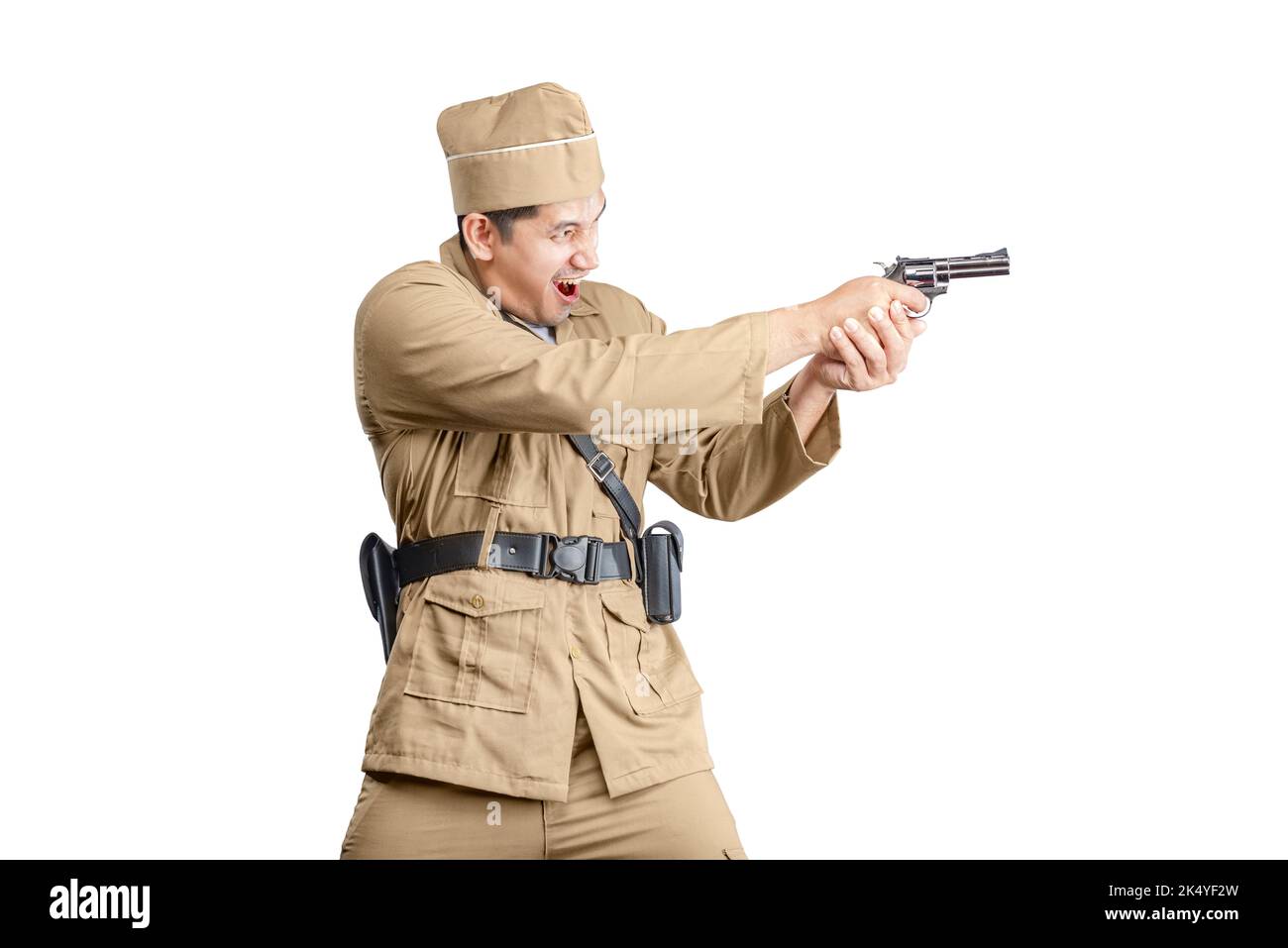 Indonesian freedom fighter standing while holding gun isolated over ...