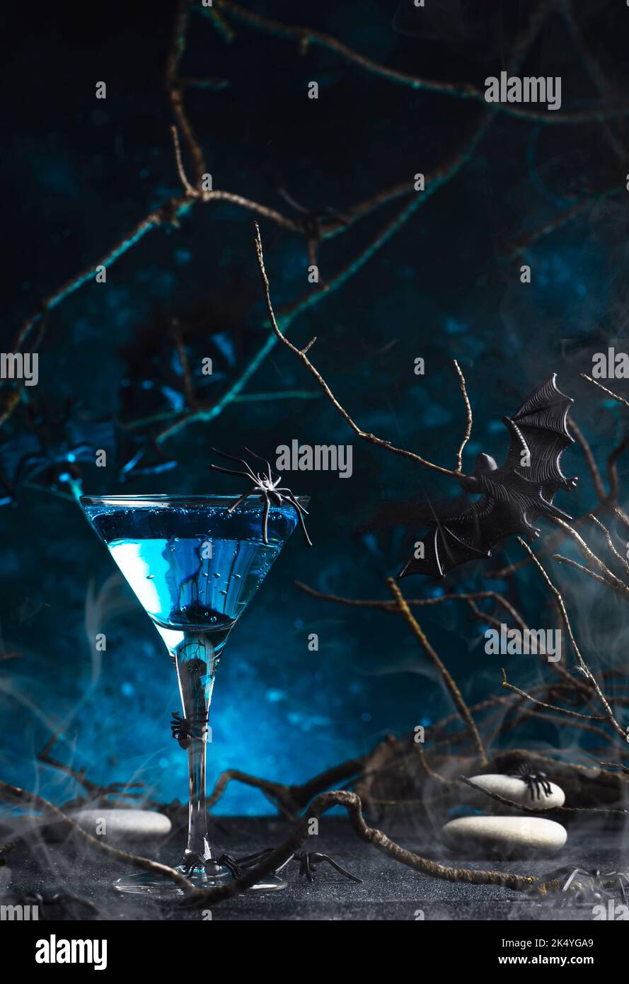 Halloween martini alcoholic cocktail on scary dark blue background with ...