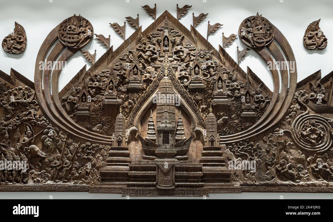 Handicrafts of teak wood carving reliefs of Angkor Wat. The panel is ...