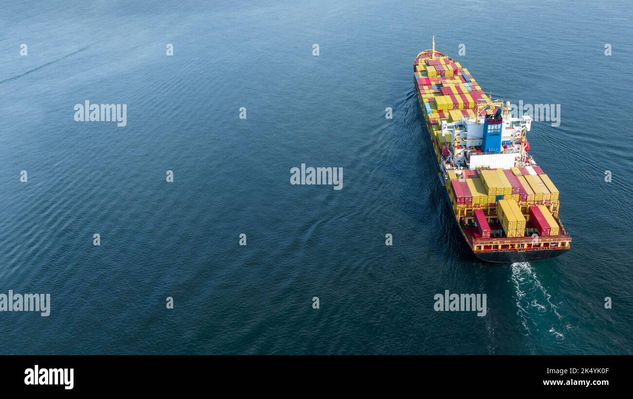 Stern of large cargo ship import export container box on the ocean sea ...