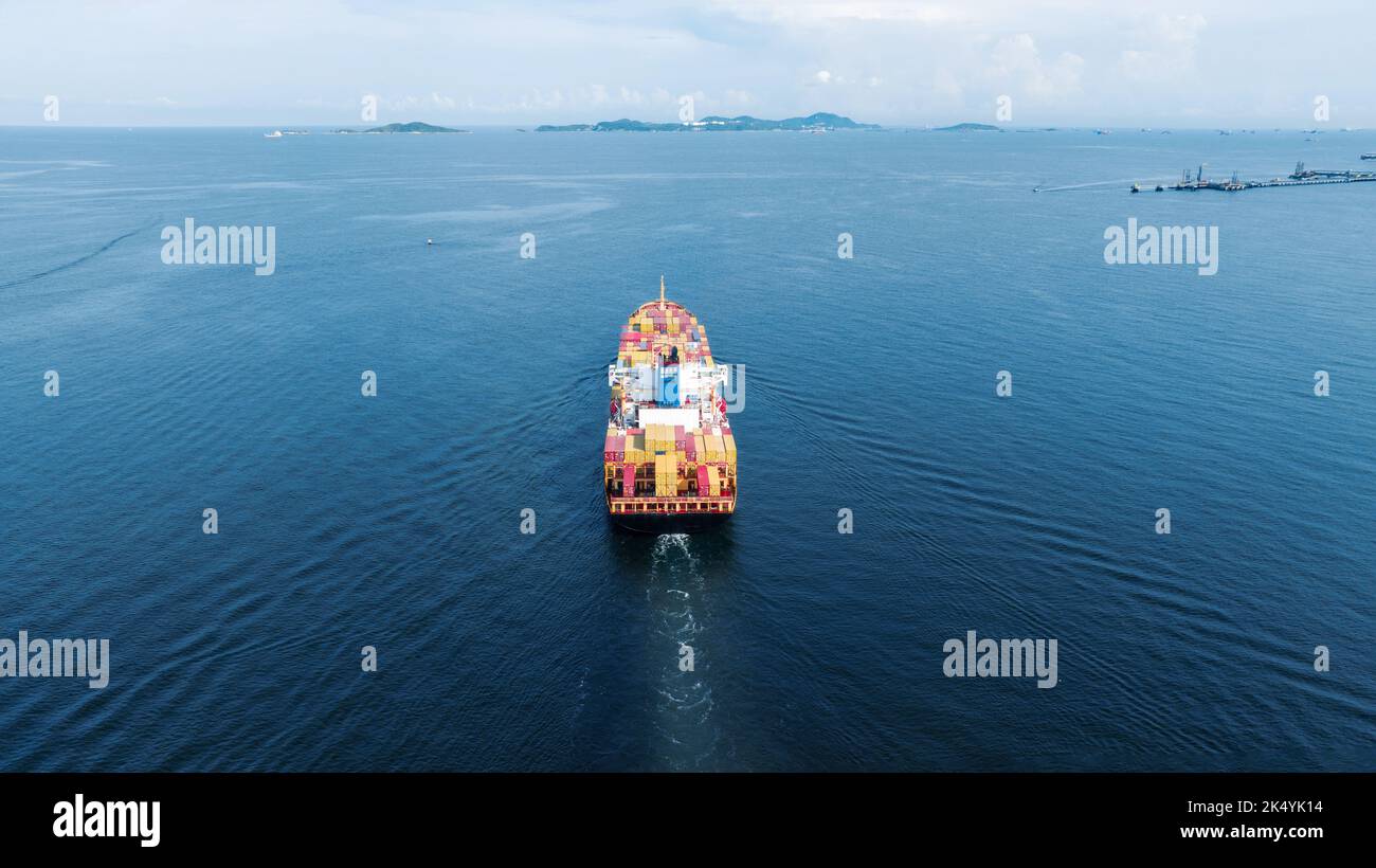 Stern of large cargo ship import export container box on the ocean sea ...