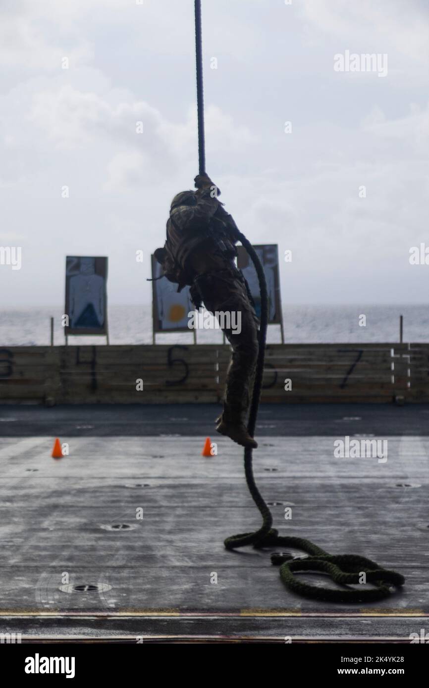 A U.S. Marine with Maritime Raid Force, 31st Marine Expeditionary Unit ...
