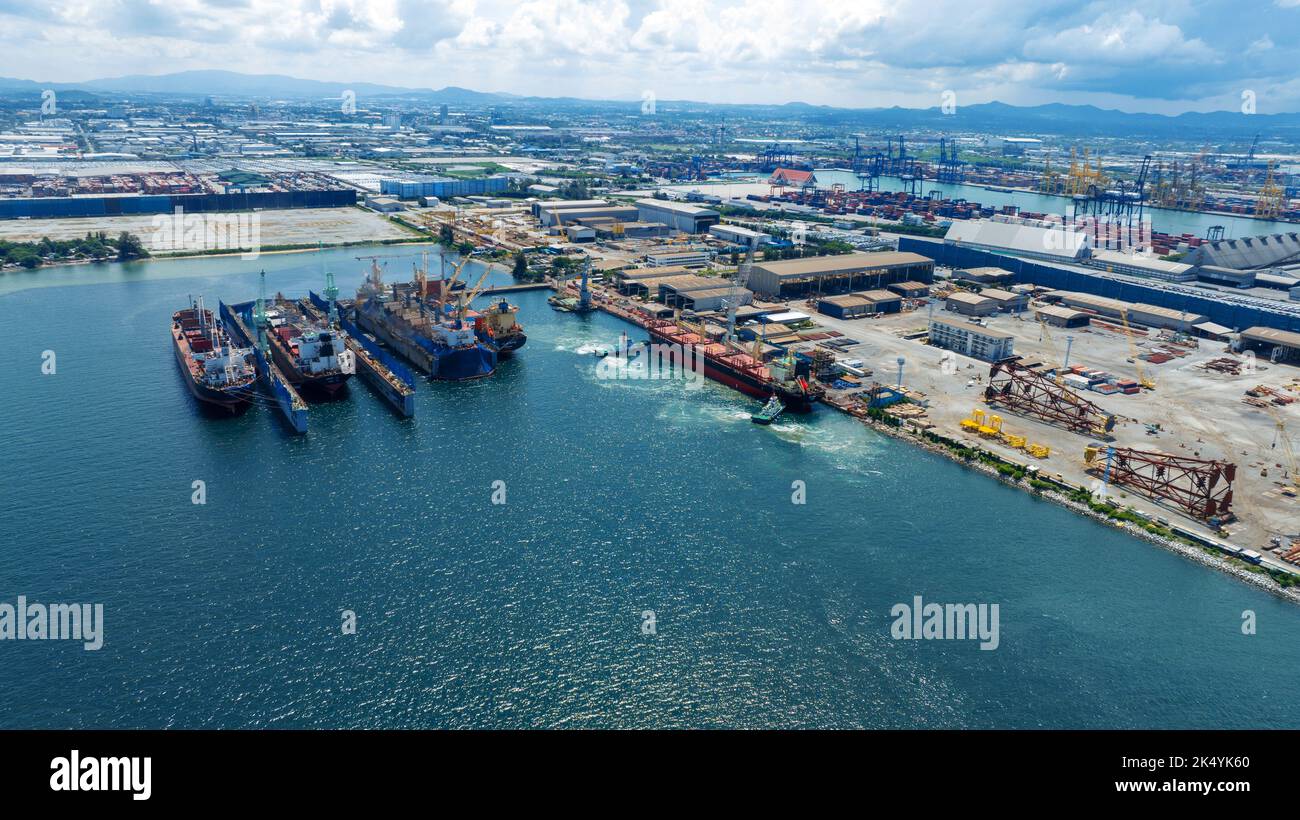 cargo container ship at dry dock concept maintenance service working in ...