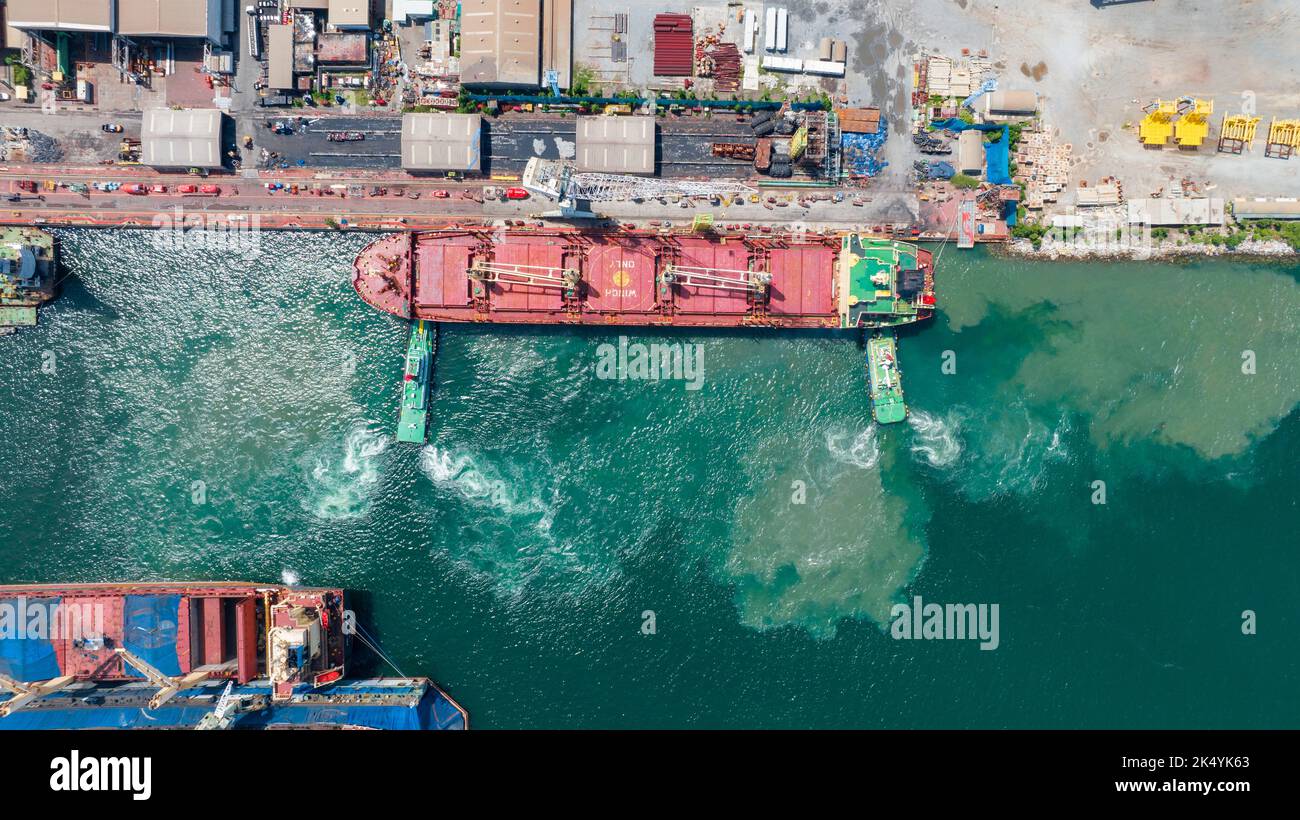 cargo container ship at dry dock concept maintenance service working in ...