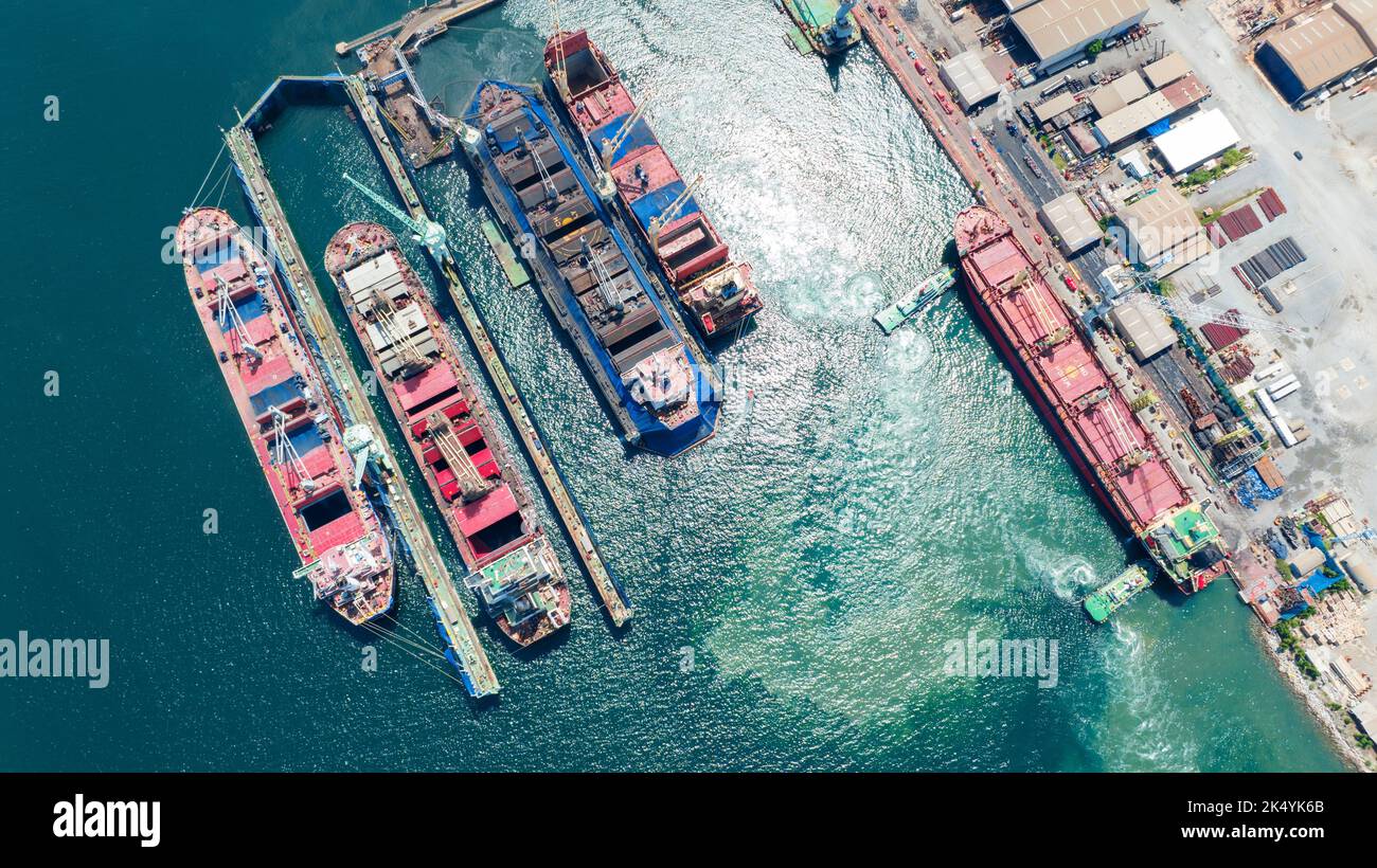 cargo container ship at dry dock concept maintenance service working in ...