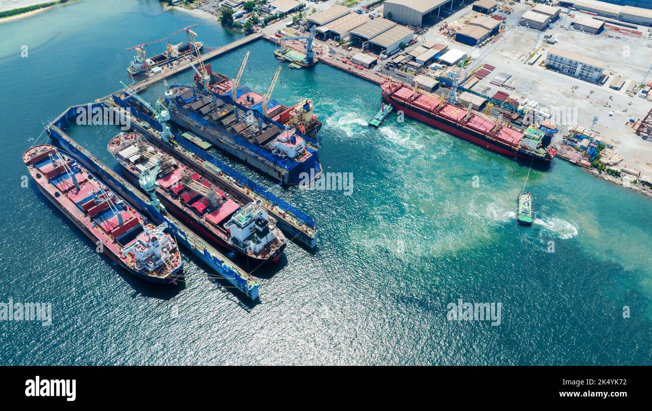 cargo container ship at dry dock concept maintenance service working in ...
