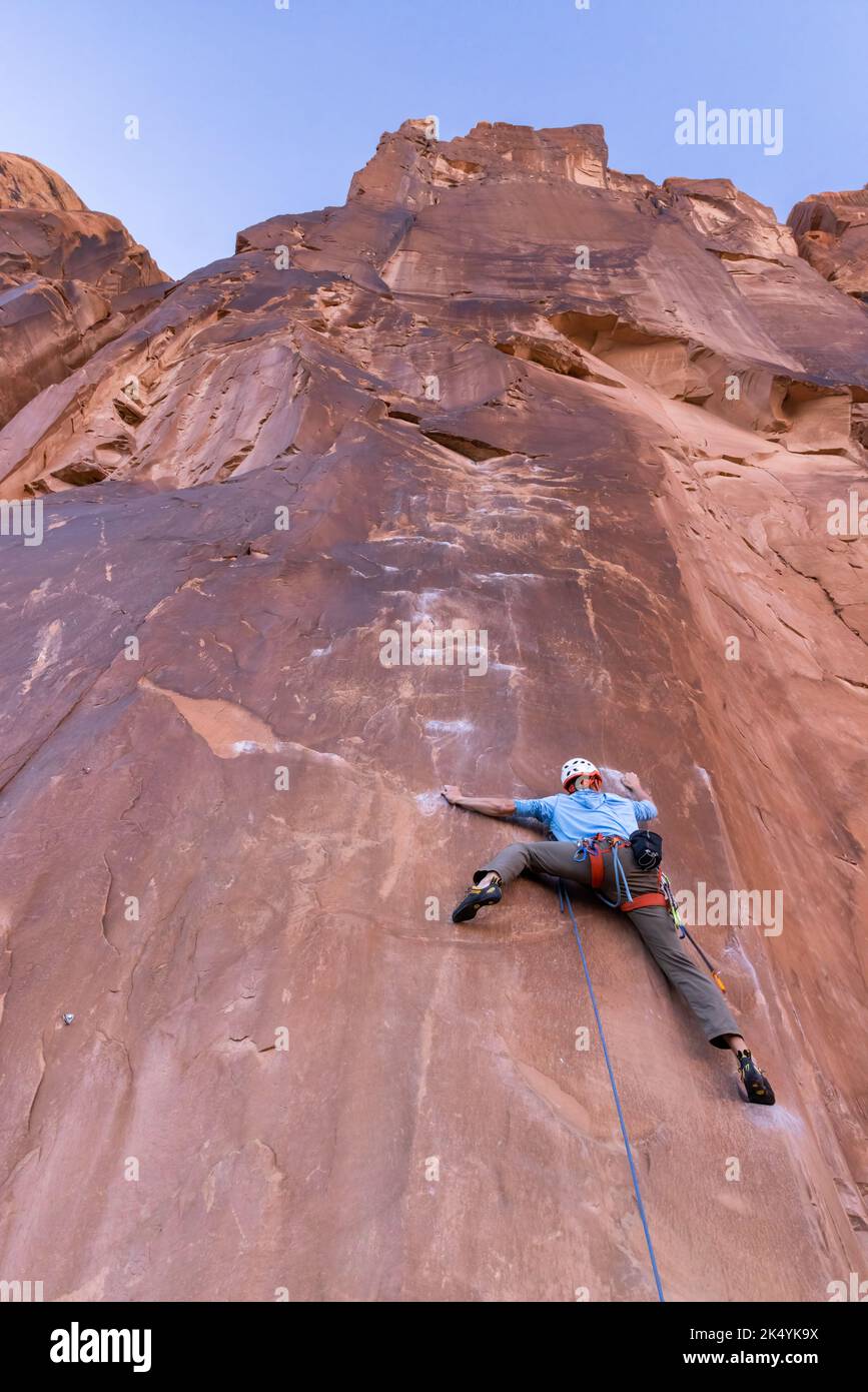 Male rock climber on sandstone cliff near Moab, Utah Stock Photo - Alamy