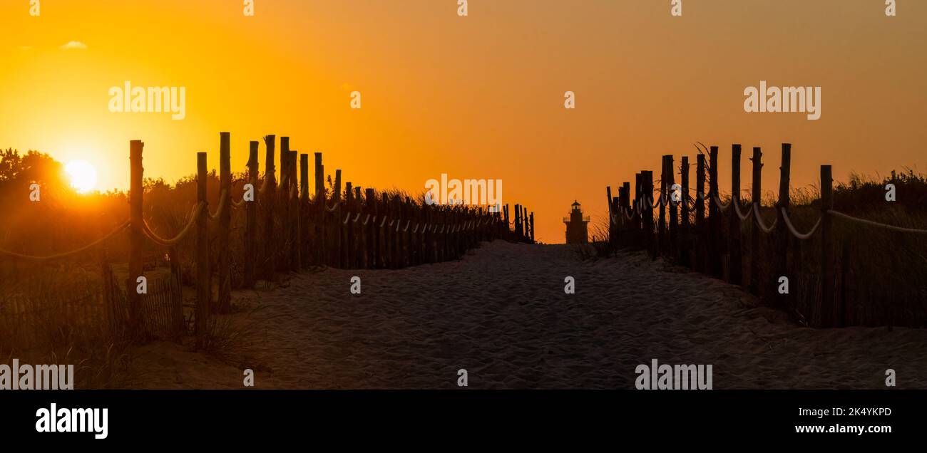 Golden sunset with path and light house, Cape Henlopen State Park ...