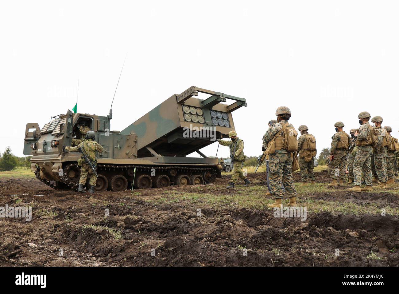 U.S. Marines with 12th Marine Regiment, 3d Marine Division, observe ...
