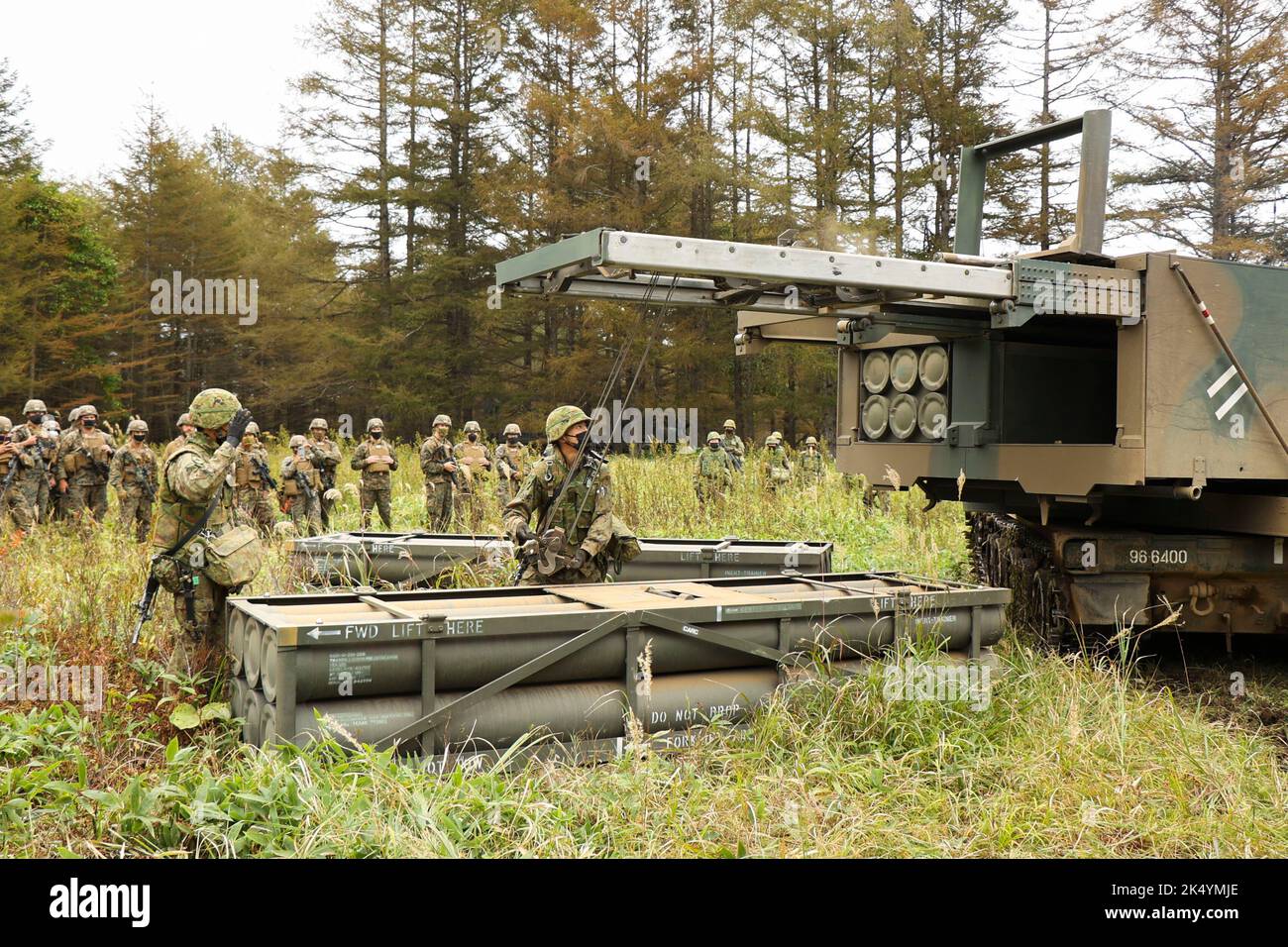 U.S. Marines with 12th Marine Regiment, 3d Marine Division, observe ...