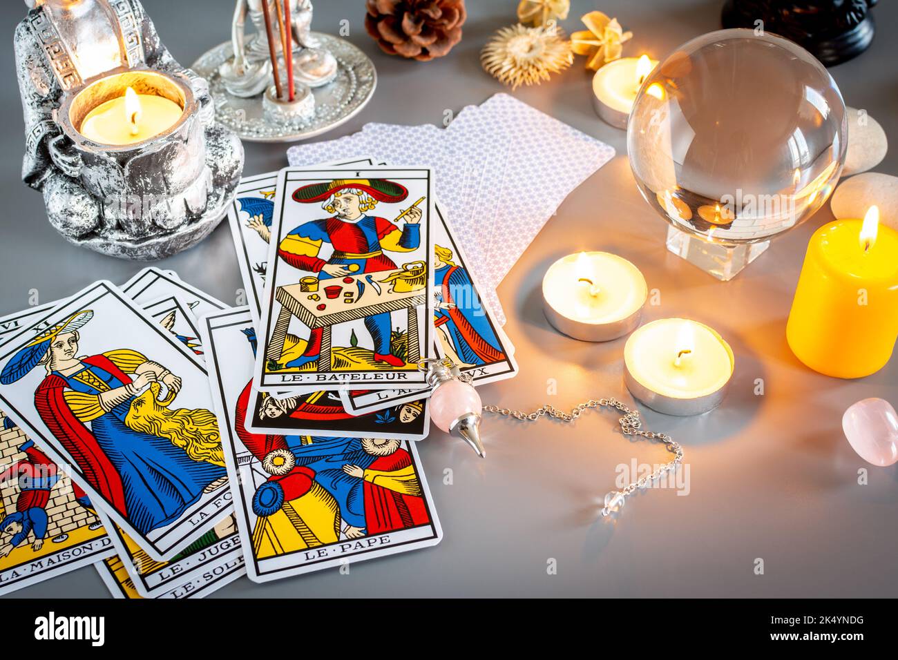 Fortune telling. Tarot de Marseille and divinatory pendulum Stock Photo ...