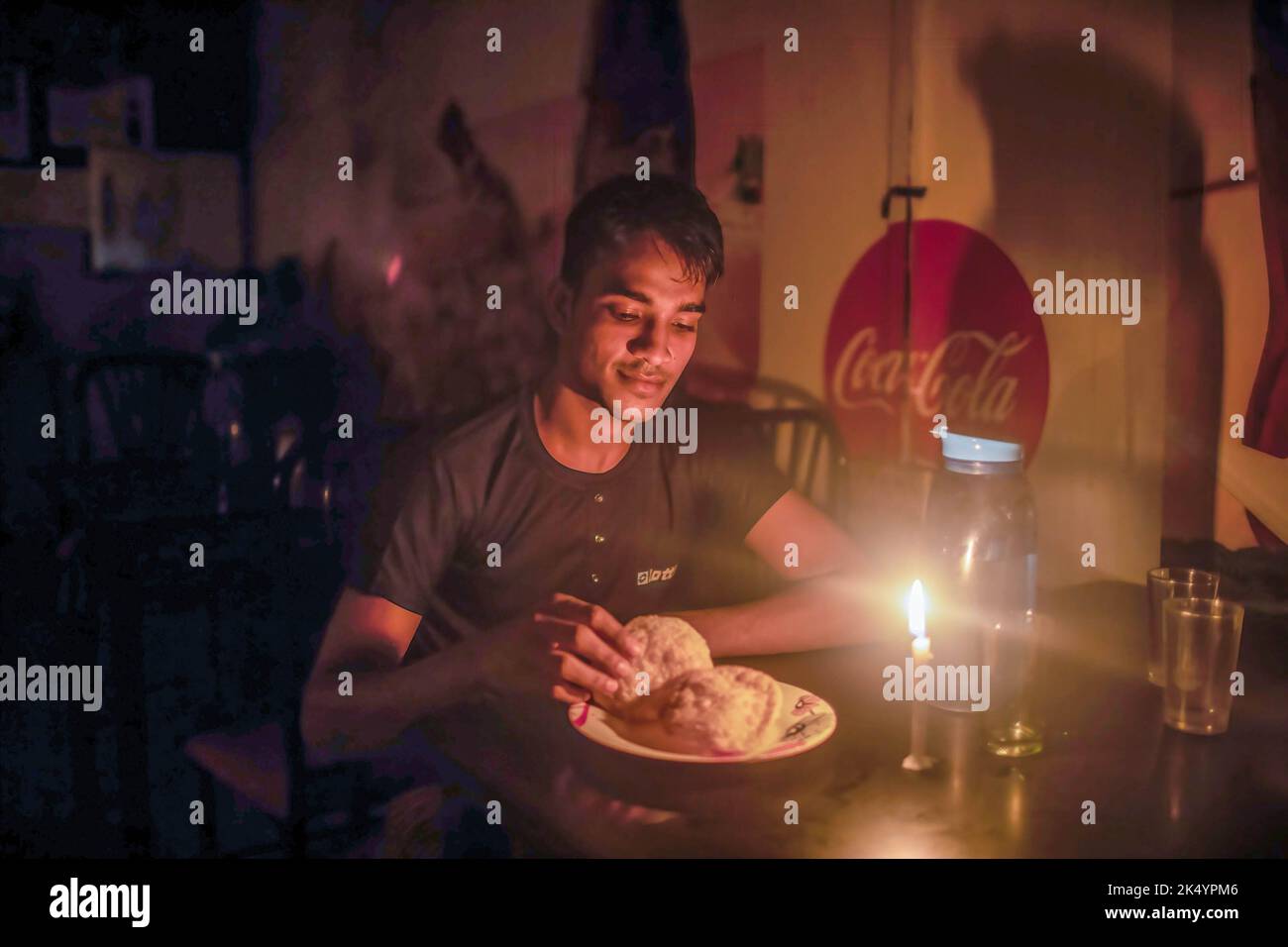 Dhaka, Bangladesh. 04th Oct, 2022. A man eats in a restaurant under ...