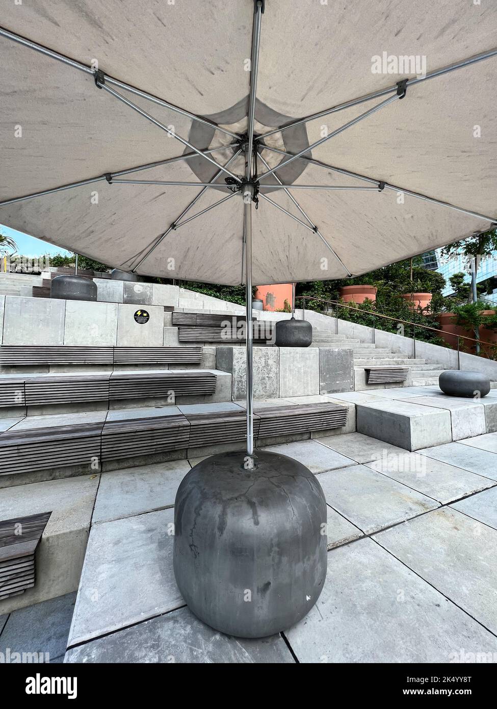 A huge shady umbrella and design of outdoor resting place for people to ...