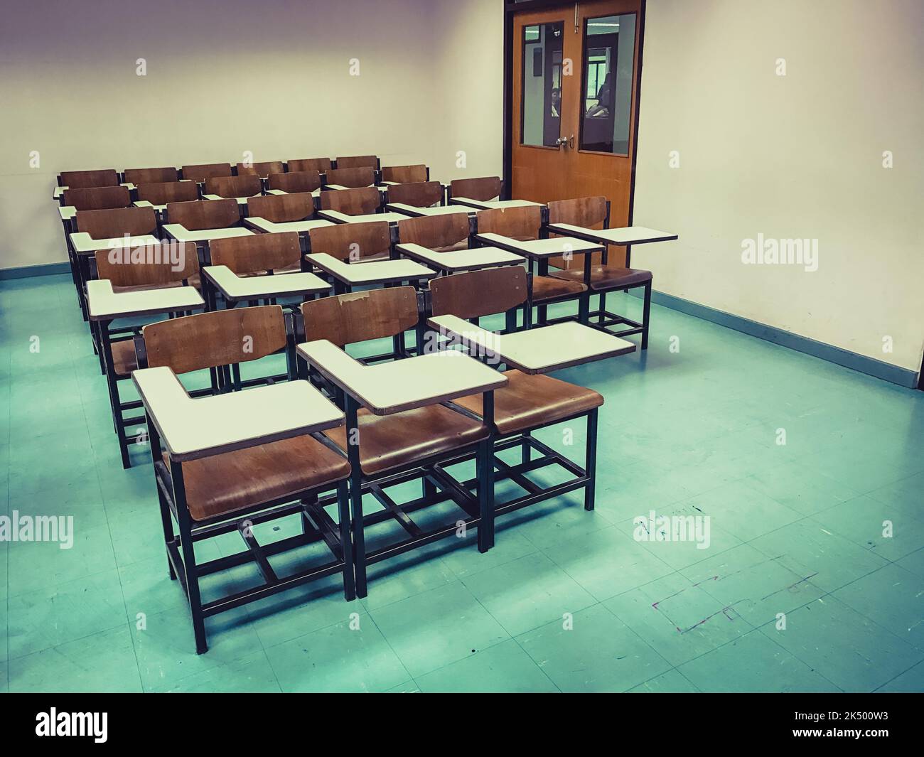 Wooden chairs in the classroom background Stock Photo - Alamy