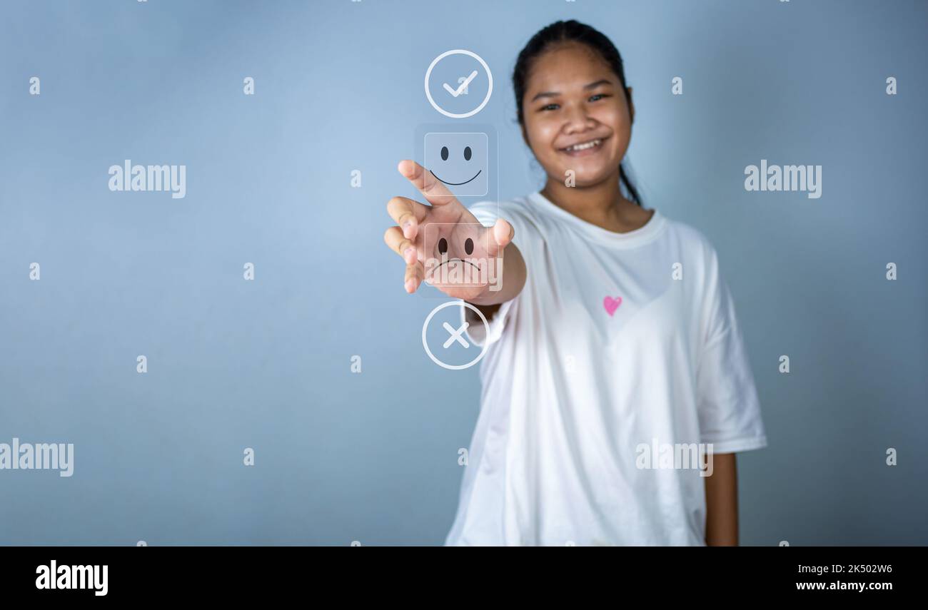 Hand choosing happy smile icon. represents feedback rating and positive ...