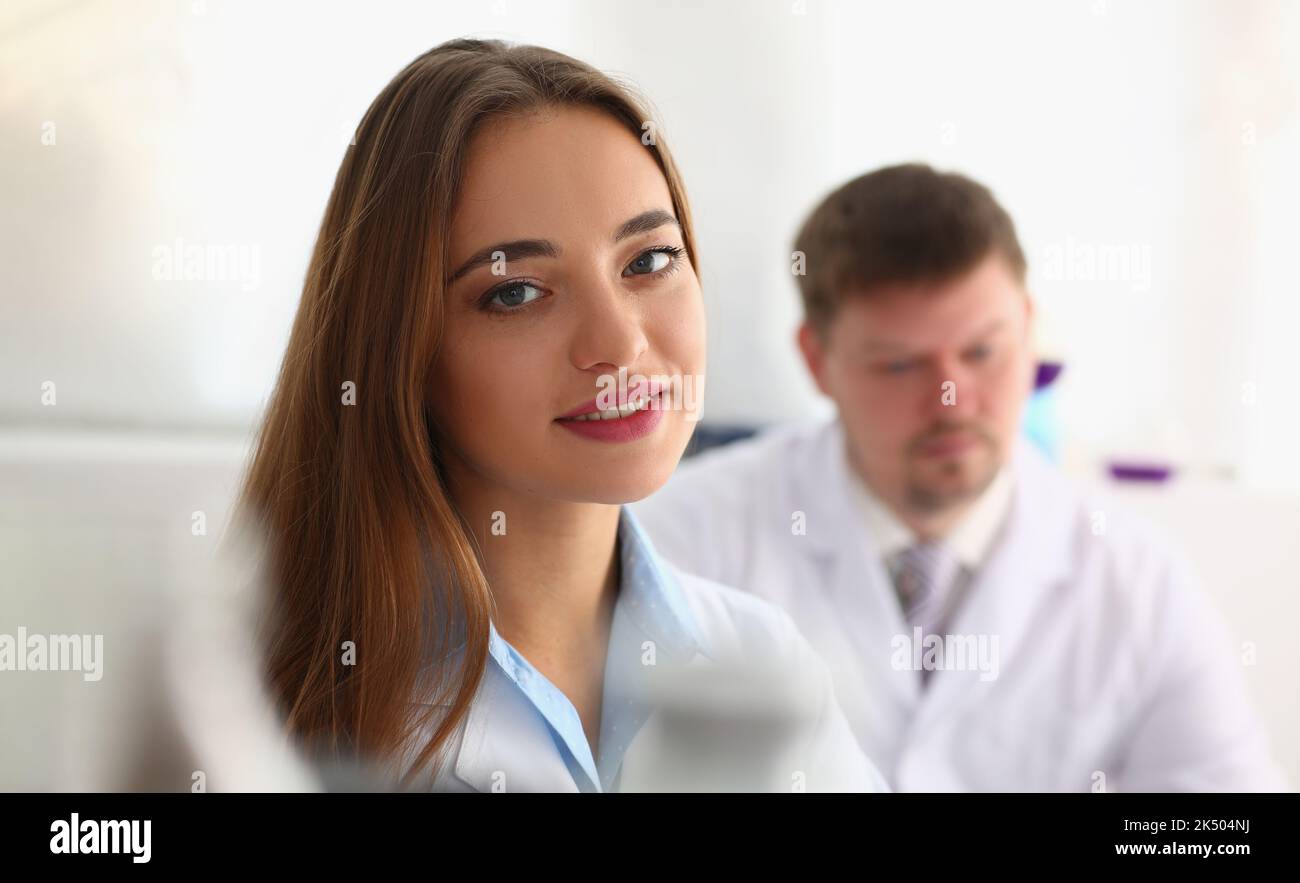 Woman patient at doctor appointment with man Stock Photo - Alamy