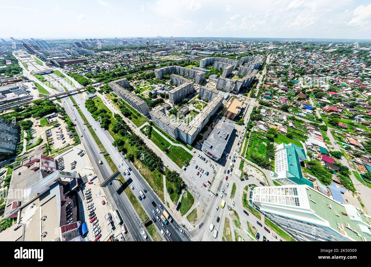 Aerial city view with crossroads and roads, houses, buildings, parks ...