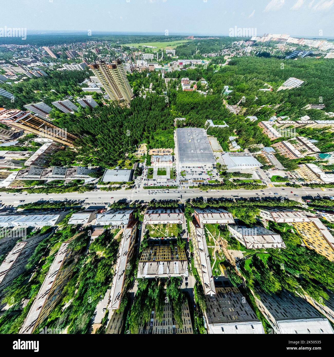 Aerial city view with crossroads and roads, houses, buildings, parks ...