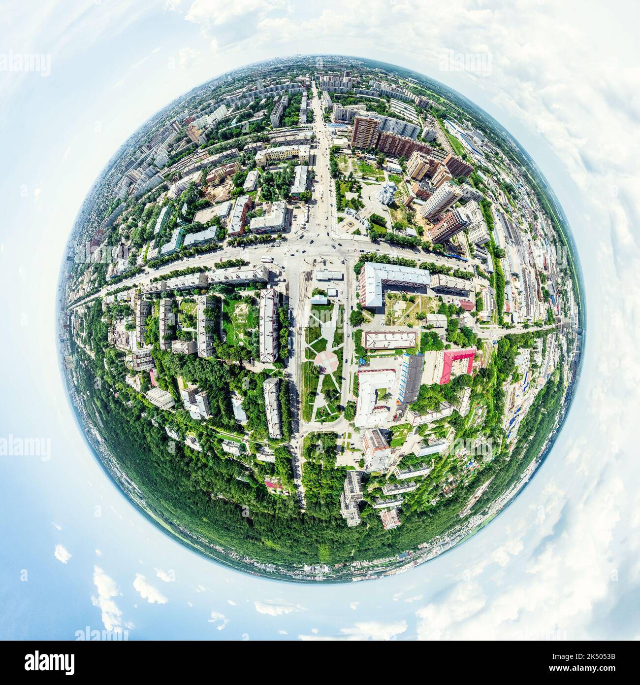 Aerial city view with crossroads and roads, houses, buildings, parks ...