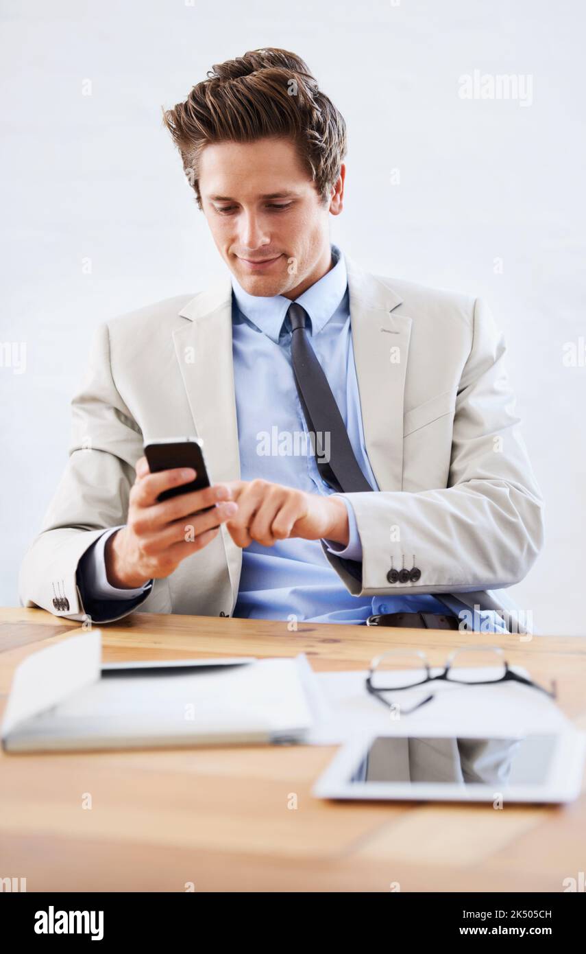 Businessman sending text message hi-res stock photography and images ...