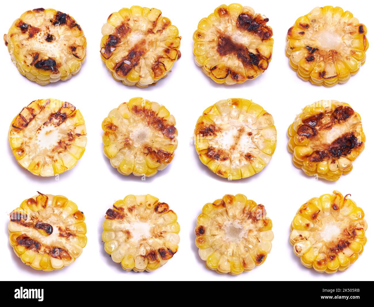 Grilled Slices of corn cobs with stripes from a grill isolated on white ...