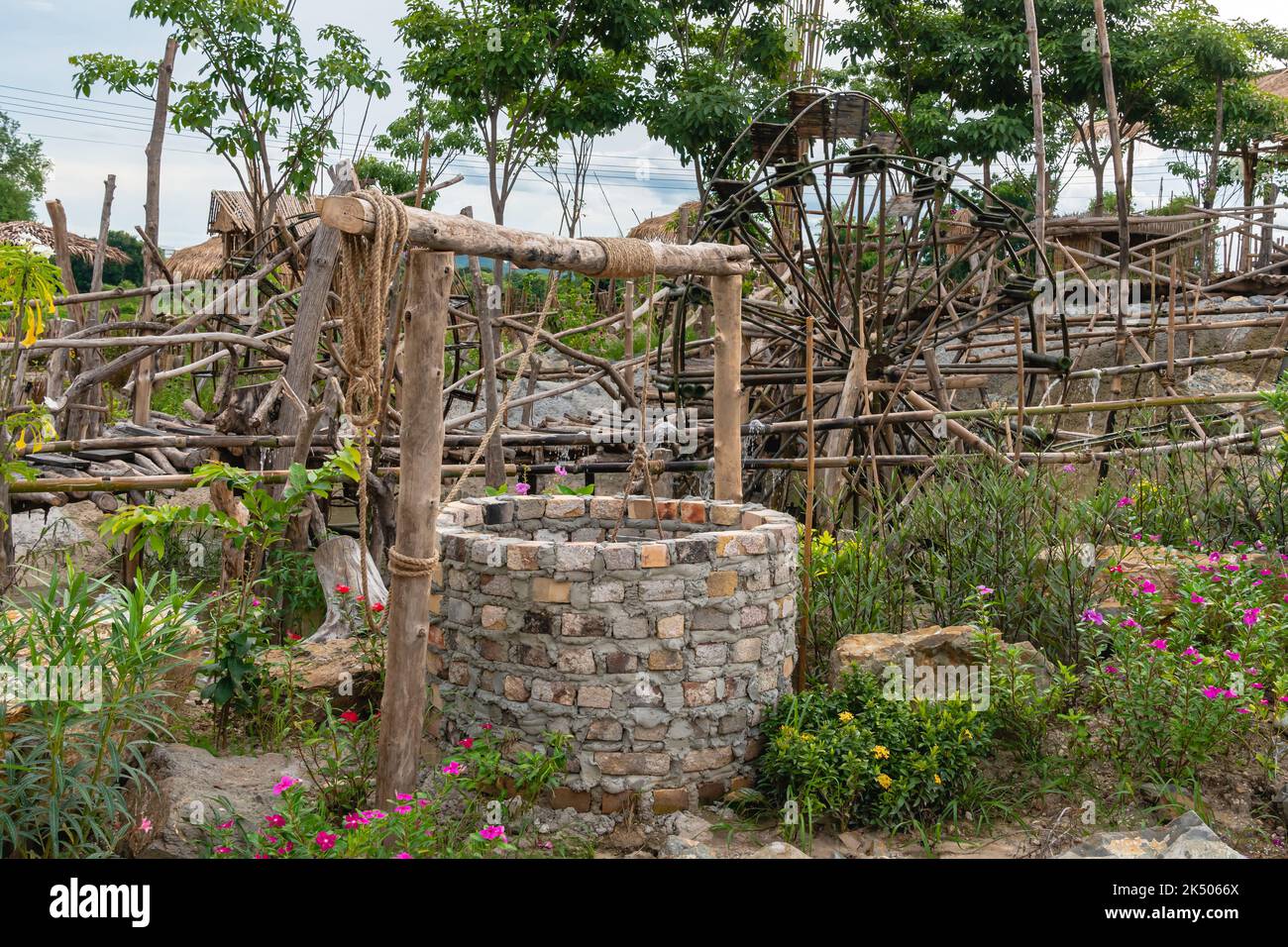 Beautiful artesian well made by bricks with cement and wheel pulley ...