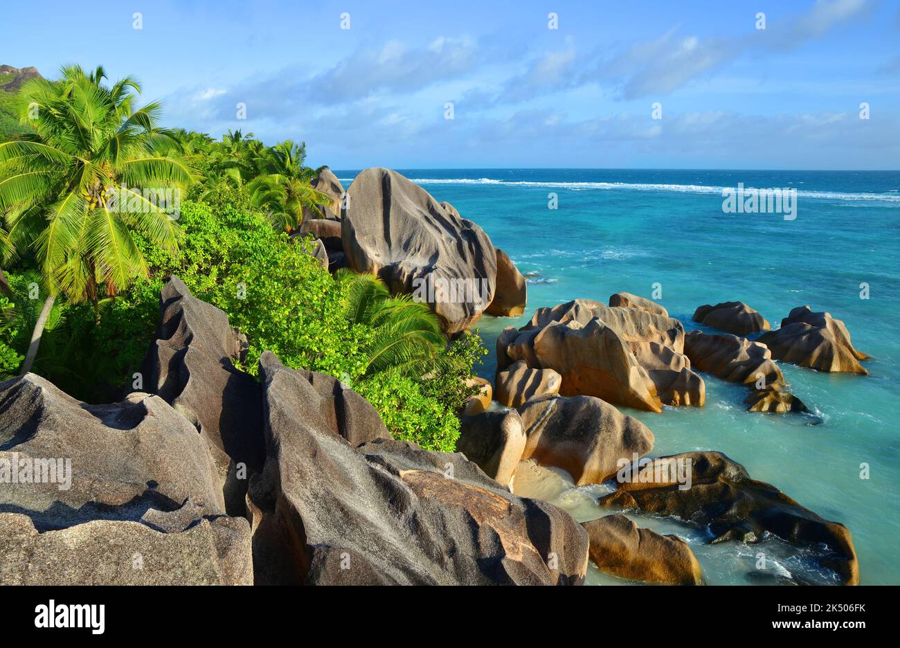 Anse Source d'Argent beach with big granite rocks in sunny day. La ...