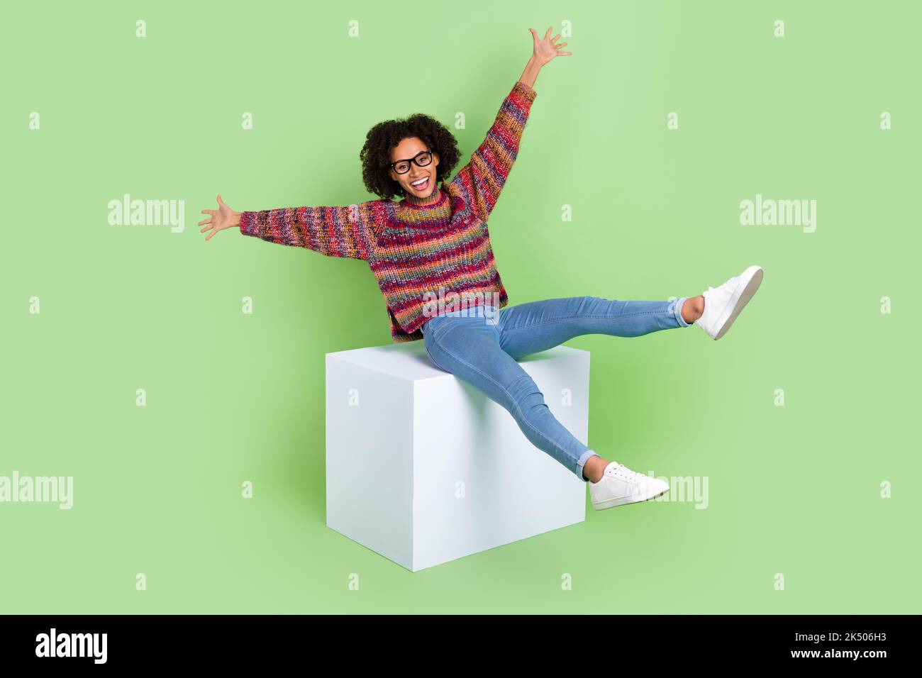 Full body portrait of satisfied cheerful person sit podium raise hands ...