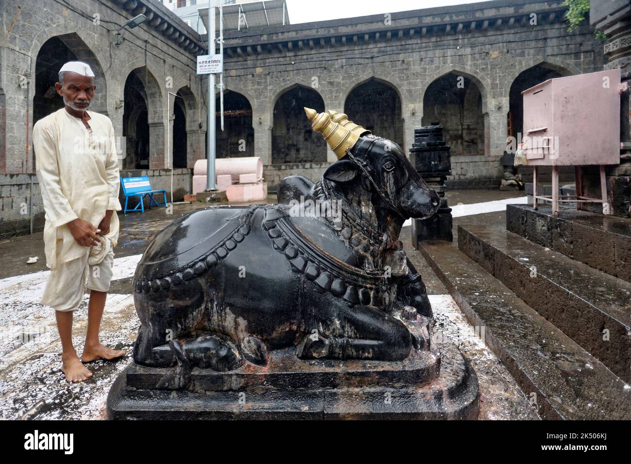 Statue of Nandi bull religious symbol in black stone at Shree ...